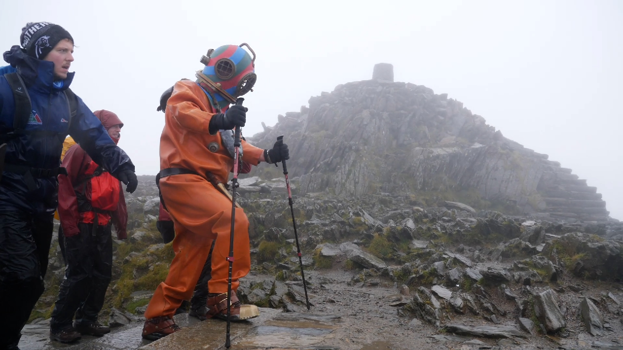 Meet the man who climbed the UK's highest peaks in a 59kg diving suit ...
